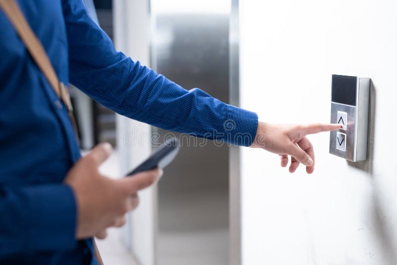 Pressing Elevator Button, Person Holding Smartphone and Waiting in ...