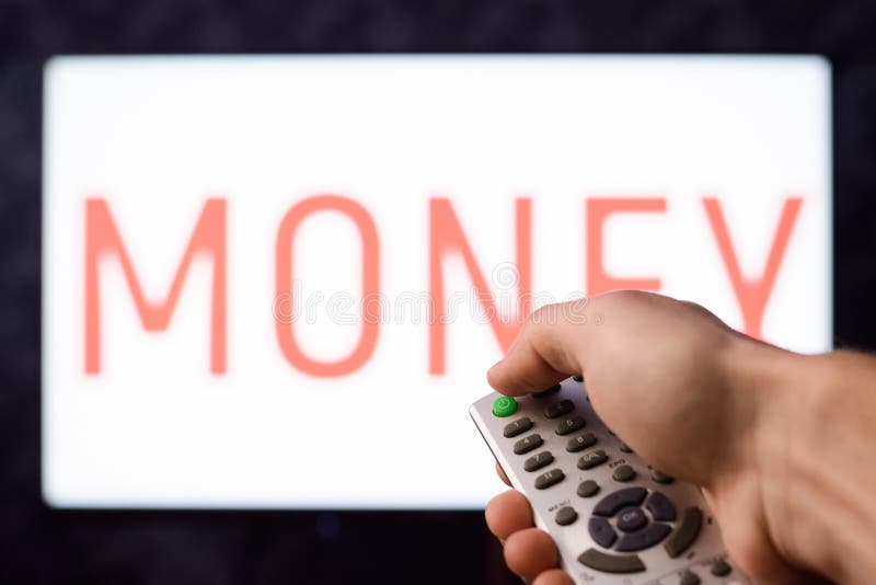 Pressing Green Button on Remote Controller Against Words Money Stock ...
