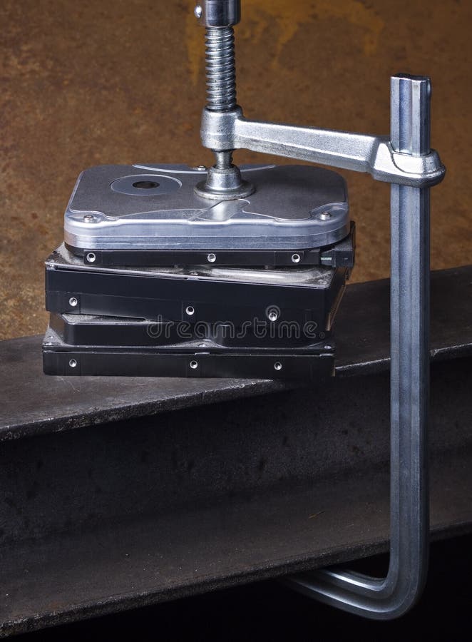 Pressing Stack of Hard Disk Drives with Clamp Stock Photo - Image of ...