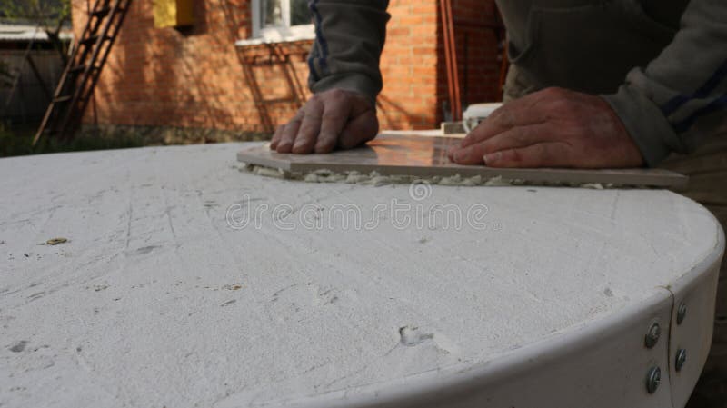 Pressing the Tile into the Mortar on the Surface Stock Photo - Image of ...