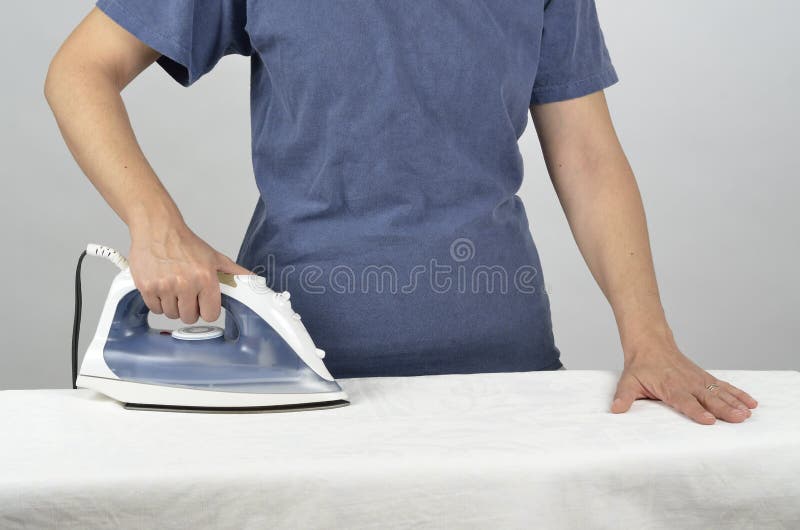 Pressing time stock photo. Image of woman, housework - 19149372