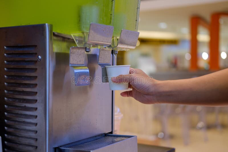 Man Pressing the Water Dispenser Head of Water Vending Machine in the ...