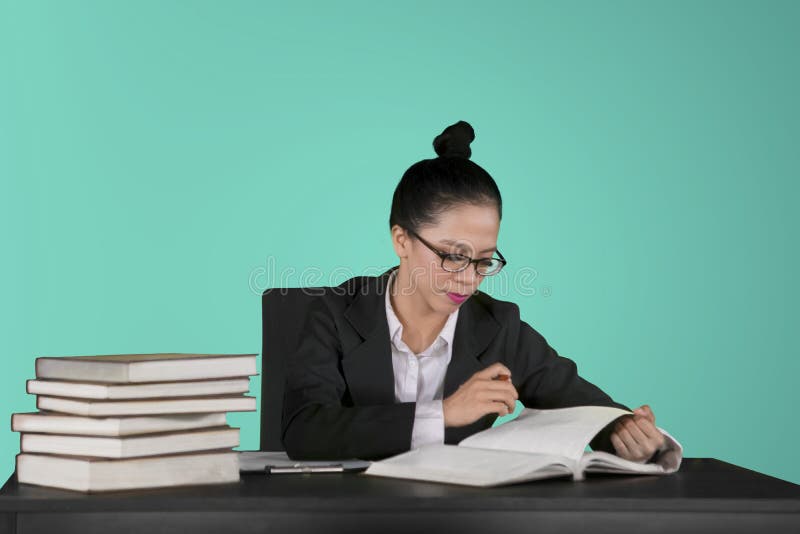 Pretty Accountant Checking a Document on Studio Stock Photo - Image of ...
