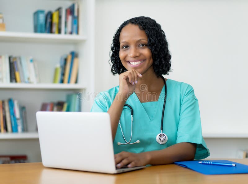 Pretty African American Doctor at Computer Stock Image - Image of ...