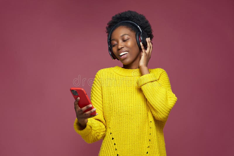 Pretty African American Young Woman Listen Music Or Podcast In