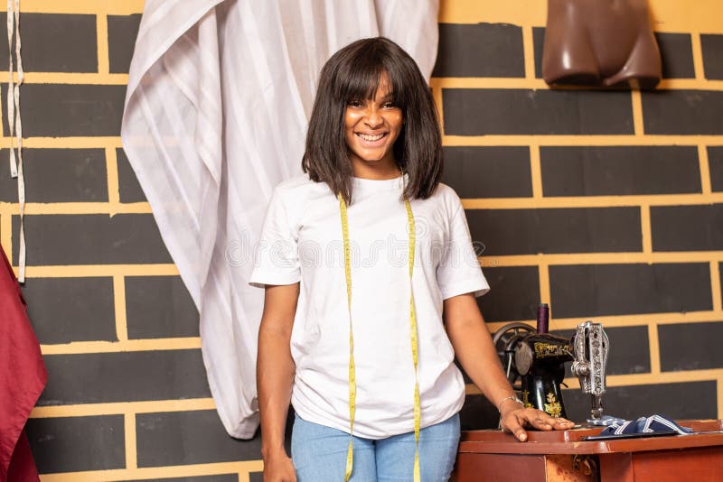 Pretty african tailor stock image. Image of lady, small - 254994183