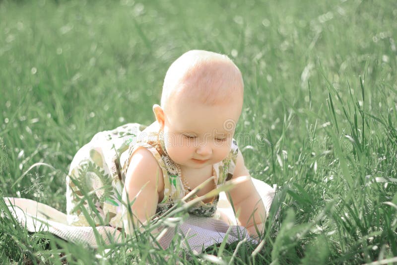 Pretty Baby Girl on the Lawn in the Spring Day Stock Photo - Image of ...