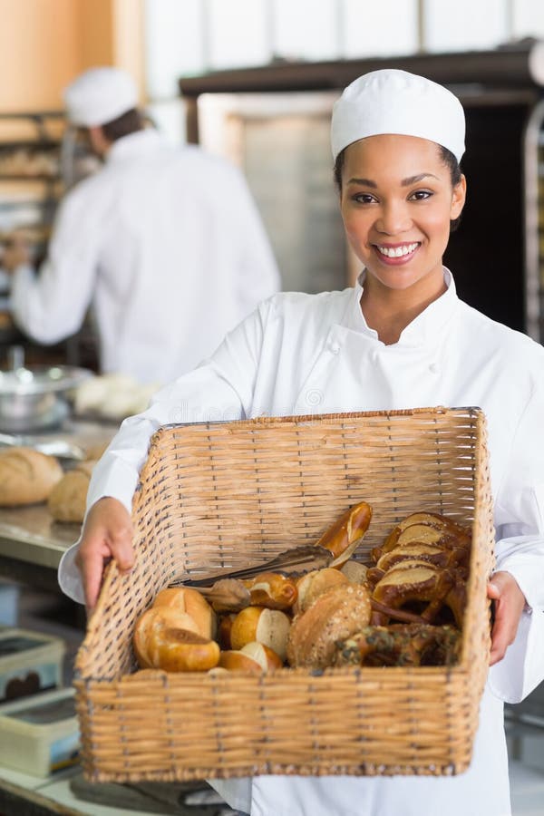 Pretty Baker Showing Basket of Bread Stock Photo - Image of drink ...