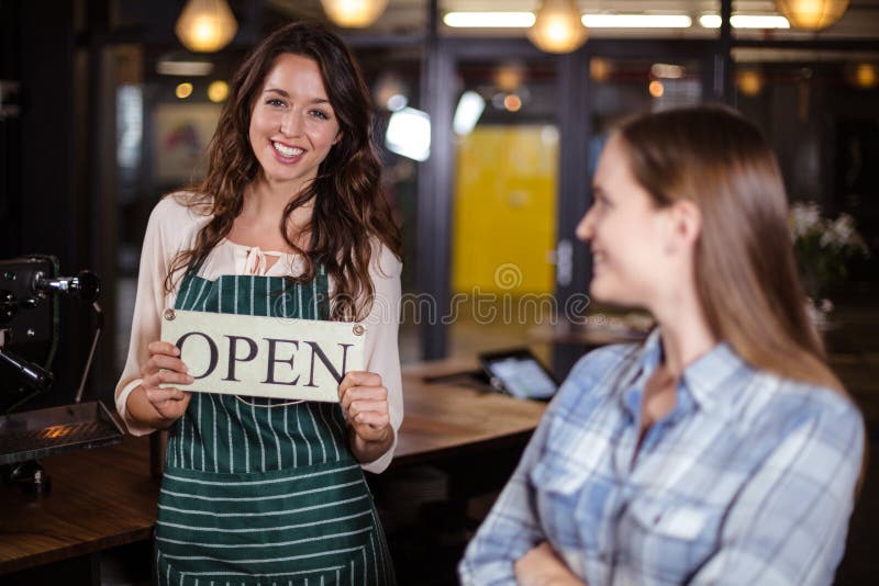 Pretty Barista Holding Open Sign Stock Photo - Image of preparation ...
