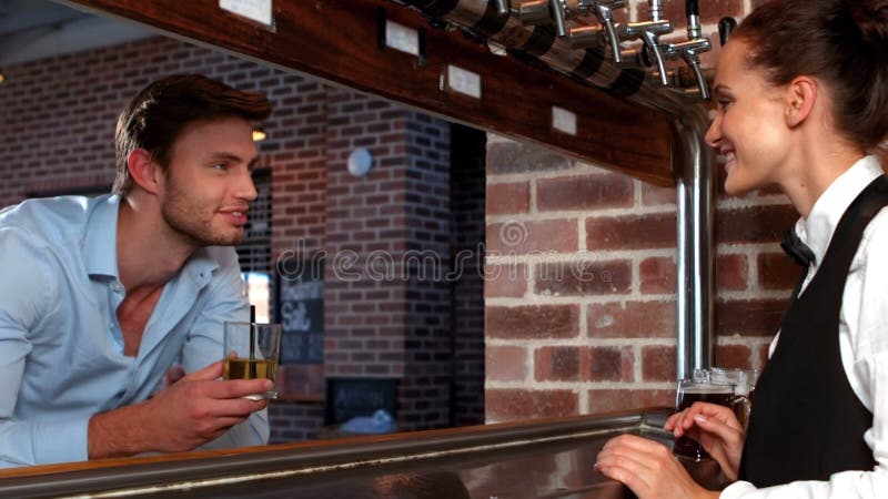Pretty Barmaid Pouring Beer in a Glass Stock Footage - Video of glass ...