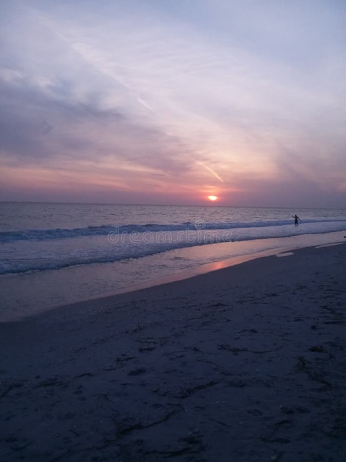 Pretty Beach Sunset stock photo. Image of water, beach - 146037120