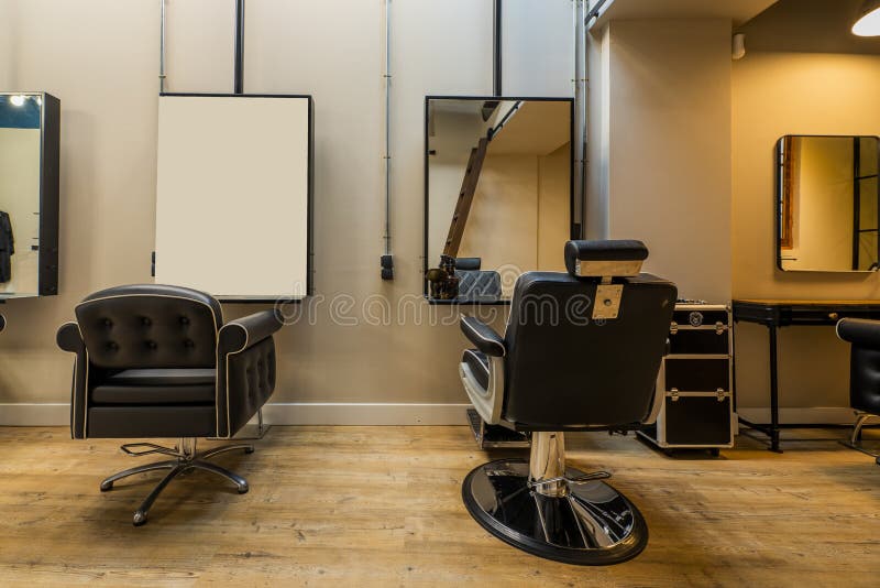 Pretty Black Leather Sofas in a Beauty Salon with Rectangular Mirrors ...