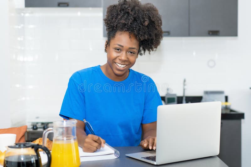 Pretty Black Woman with Computer Writing Notes Stock Photo - Image of ...