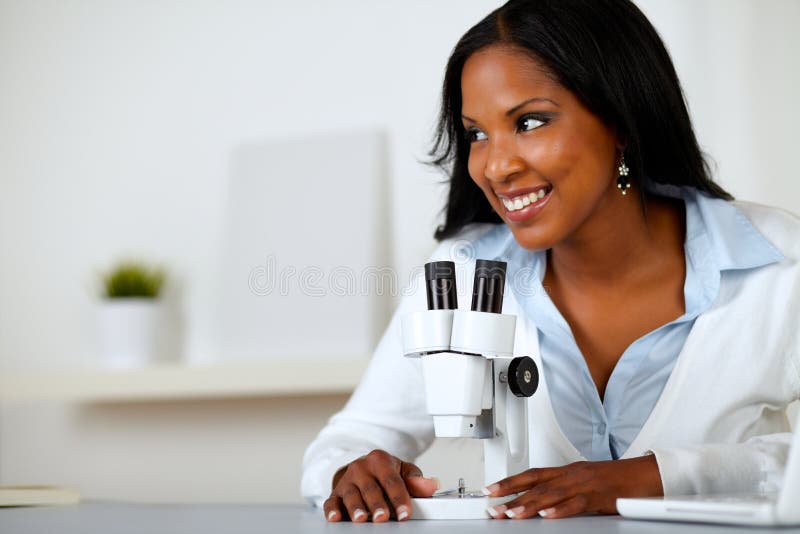 Pretty Black Woman Working with a Microscope Stock Image - Image of ...