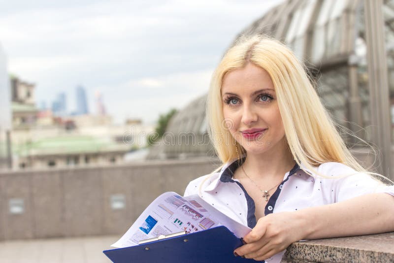 Pretty Blond Manager with Abstract Documents Outdoors. Stock Image ...