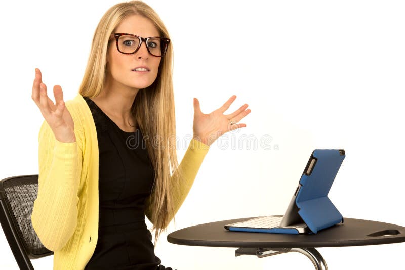 Pretty Blonde with Frustrated Expression Sitting at Desk with Ip Stock ...