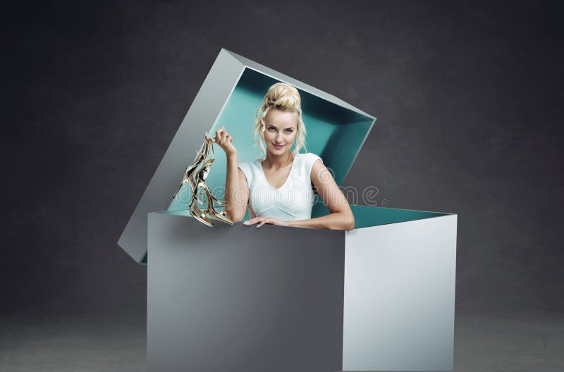 Pretty Blonde Getting Off the Gift Box Stock Image - Image of face ...