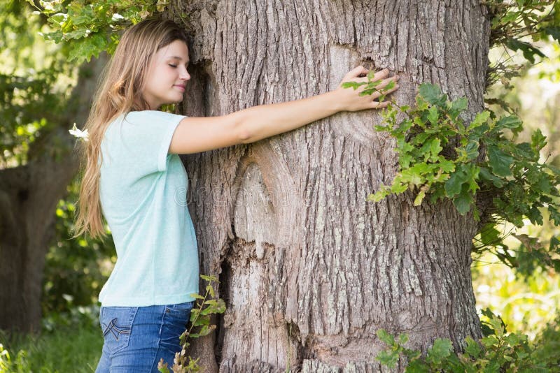 Pretty Blonde Hugging a Tree Stock Photo - Image of calm, happy: 49895880