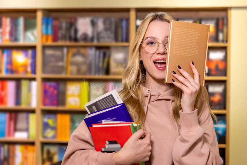 Pretty Blonde Woman Standing with Books in Library Stock Image - Image ...