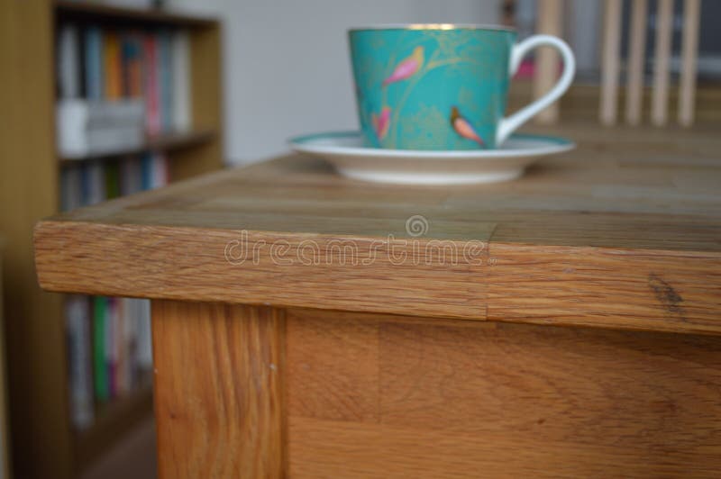 Pretty Blue Tea Cup Sitting on a Wooden Table Stock Photo - Image of ...