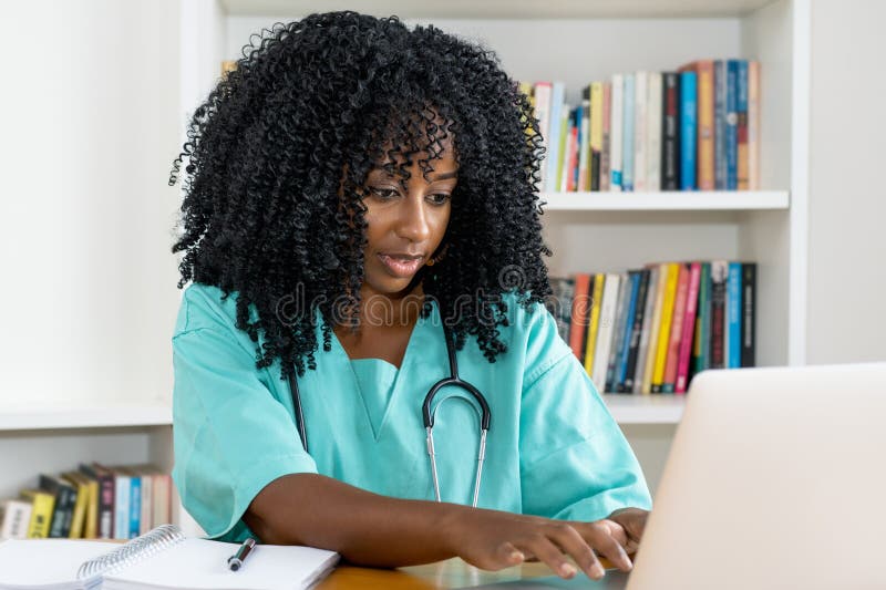 Pretty Brazilian Female Nurse Working at Computer Stock Image - Image ...