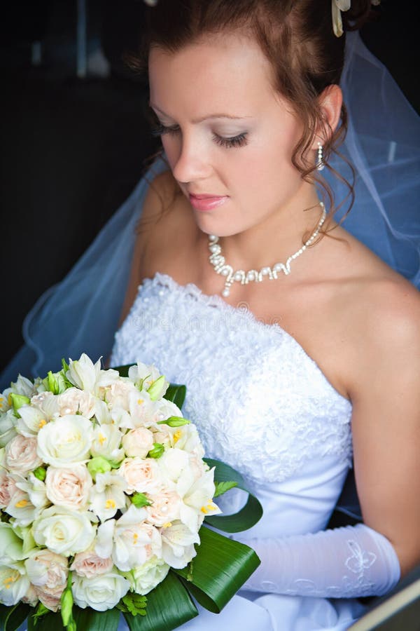 Pretty Bride with a Bouquet Stock Photo - Image of elegance, beautiful ...