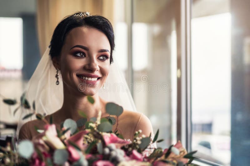 Pretty Bride with Bouquet of Flowers Stock Photo - Image of model ...