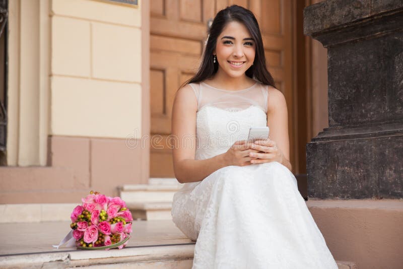 Pretty Bride with a Cell Phone Stock Photo - Image of cute, courthouse ...