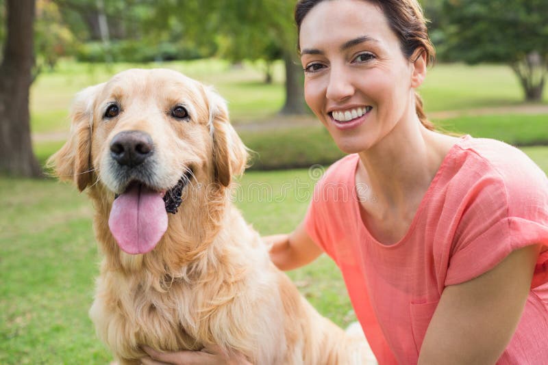 Pretty Brunette Looking at Camera with Her Dog Stock Image - Image of ...
