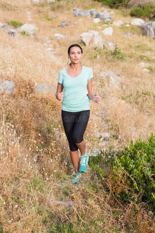 Fit Brunette Running on the Treadmill Stock Photo - Image of young ...