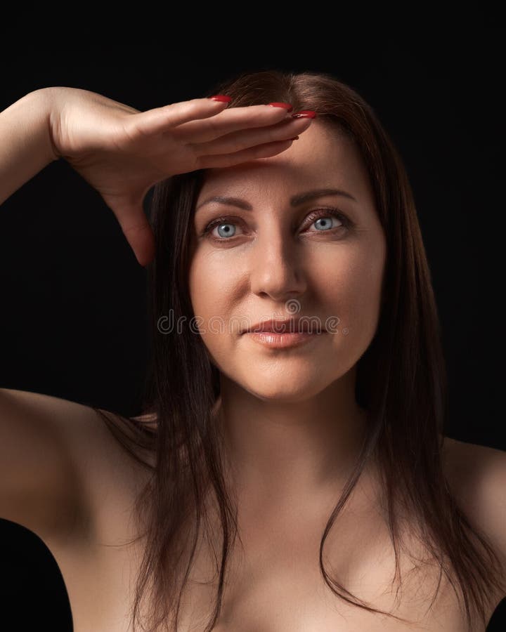 Cheerful Woman Laughing While Covering Mouth With Her Hands And Gazing