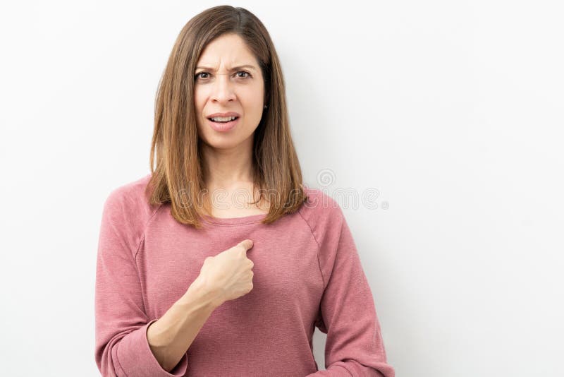 Confused Woman Pointing at Herself Stock Photo - Image of portrait ... Confused Woman Pointing at Herself Stock Photo - Image of portrait ...