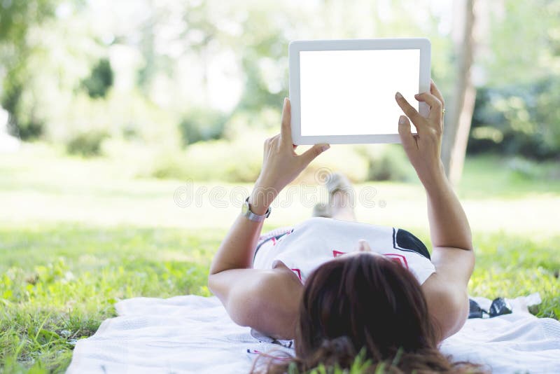 Pretty Brunette Woman Using Tablet in Park Stock Image - Image of ...
