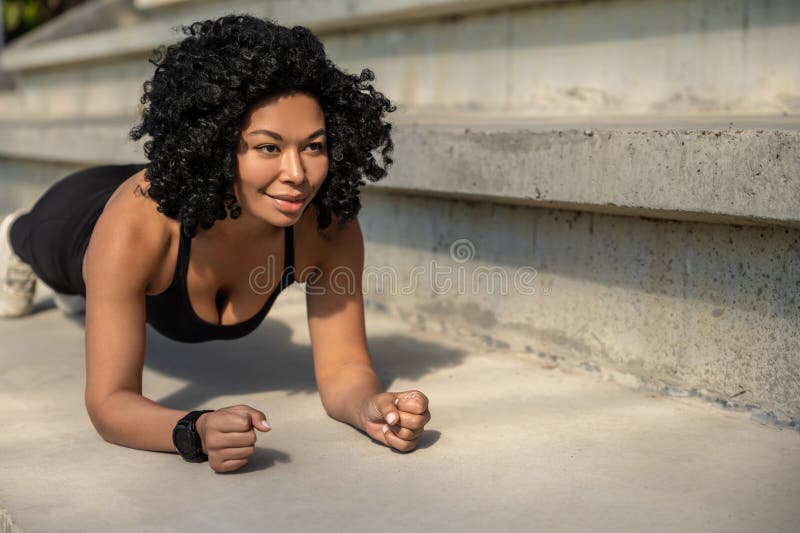 Pretty Brunette Young Woman Standing in a Plank Stock Photo - Image of ...
