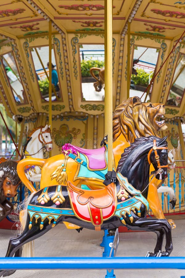 Pretty Kid on Carousel Horse. Cute Girl is Riding Attraction. Fun ...