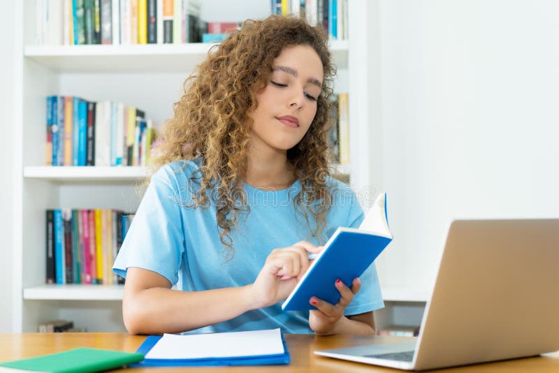 Pretty Caucasian Female Student Reading Reference Book Stock Photo ...