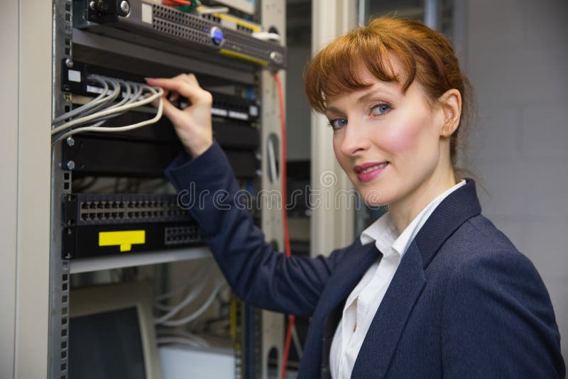 Pretty Computer Technician Smiling at Camera while Fixing Server Stock ...