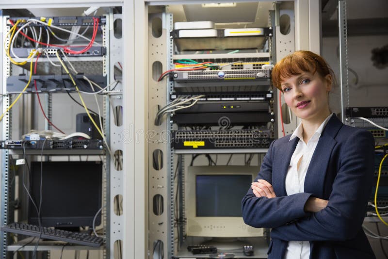 Pretty Computer Technician Smiling at Camera beside Server Stock Image ...