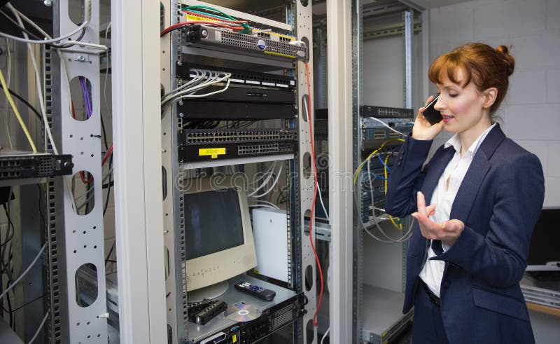 Pretty Computer Technician Talking on Phone beside Open Server Stock ...