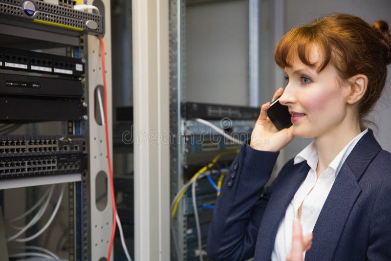 Pretty Computer Technician Talking on Phone beside Open Server Stock ...