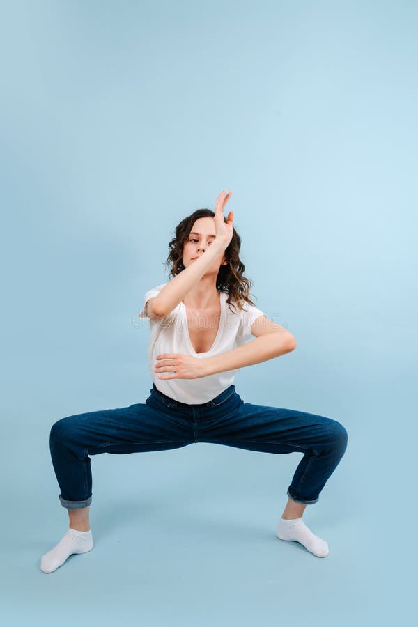 Pretty Contemporary Dancer in Solid Stance, Making Moves with Her Arms ...