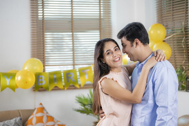 Pretty Couple Hugging while Posing in Front of Camera Stock Photo ...