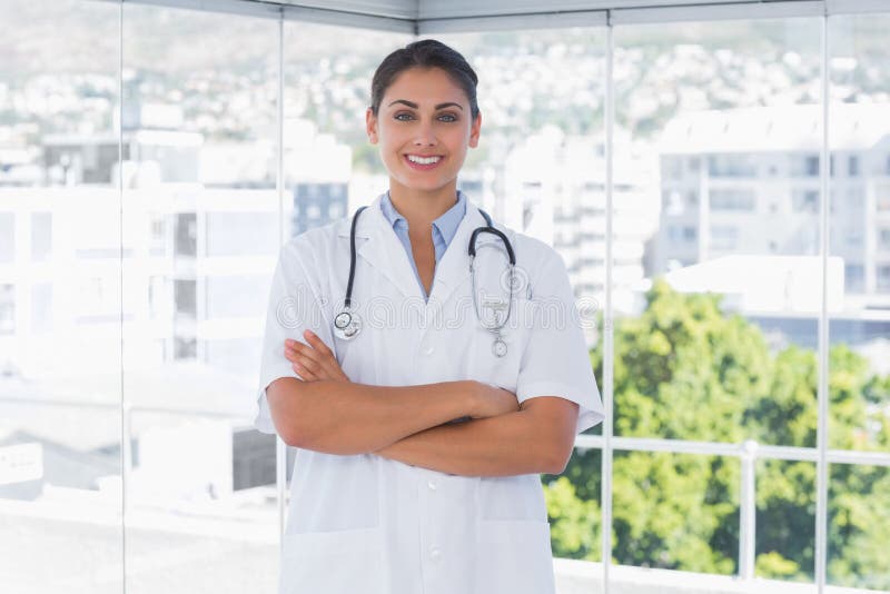 Pretty Doctor Showing a Folder To a Colleague Stock Image - Image of ...