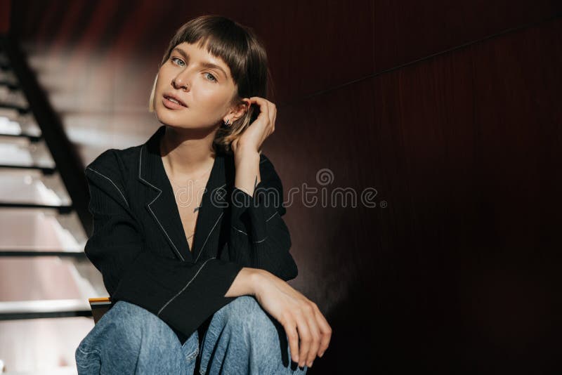 Pretty Fair Skinned Woman Wearing Black Shirt Blue Jeans Looking At