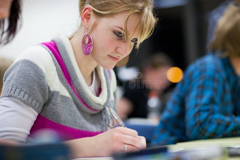 Pretty Female College Student in a Classroom Stock Photo - Image of ...