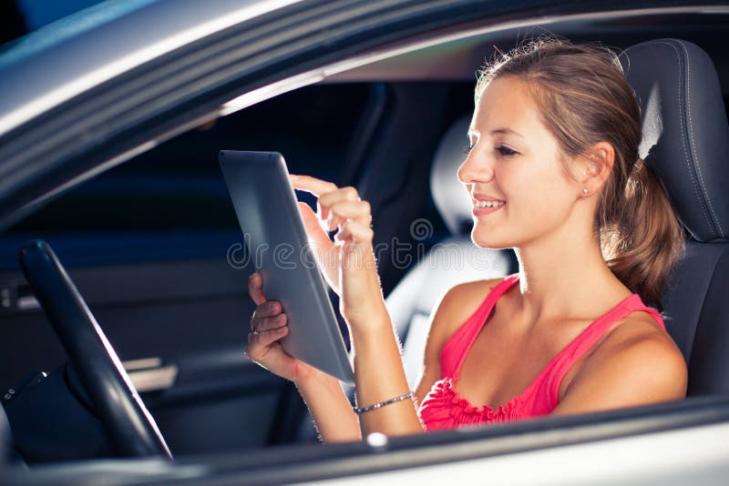 Pretty, Female Driver Using Her Tablet Computer Stock Image - Image of ...