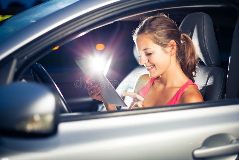 Pretty, Female Driver Using Her Tablet Computer Stock Photo - Image of ...