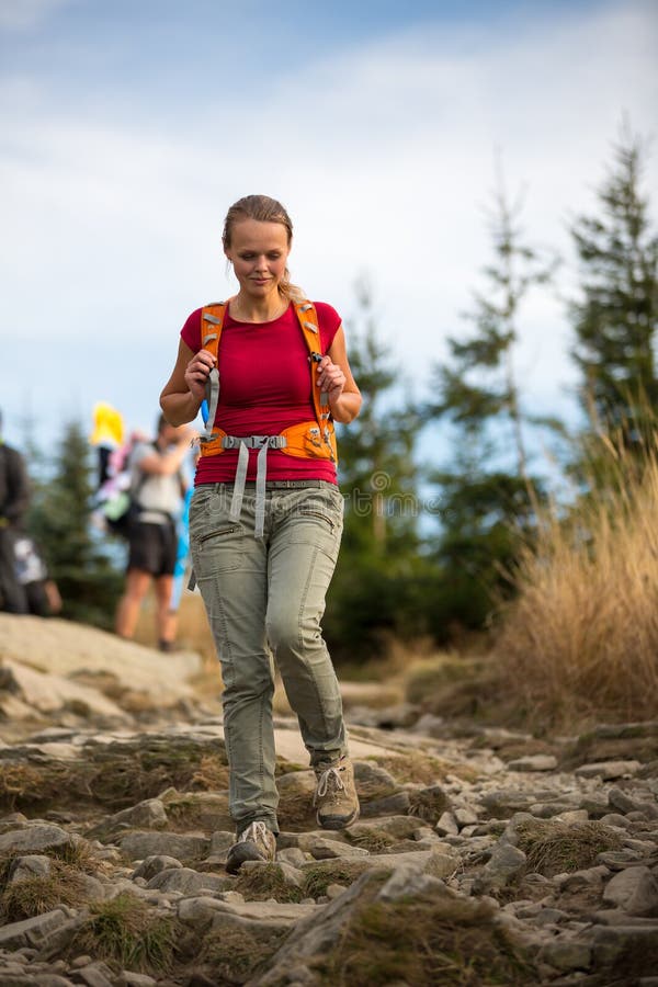 Pretty, Female Hiker Going Downhill Stock Photo - Image of caucasian ...