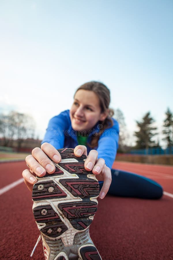 Pretty Female Runner Stretching before Her Run Stock Photo - Image of ...