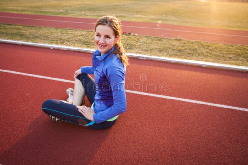 Pretty Female Runner Stretching before Her Run Stock Photo - Image of ...